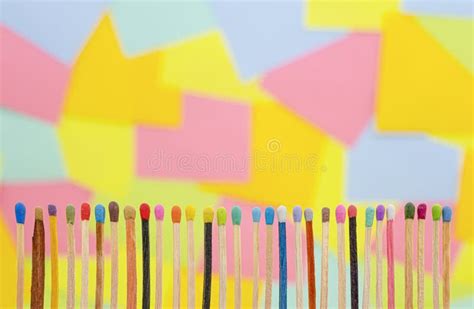 Matchsticks Of Various Shapes And Colors With Multicolored Paper Sticky