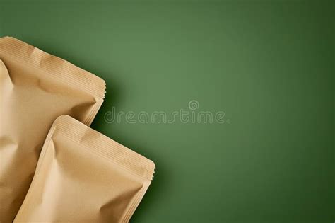 Eco Friendly Kraft Paper Pouches On Green Background Sustainable
