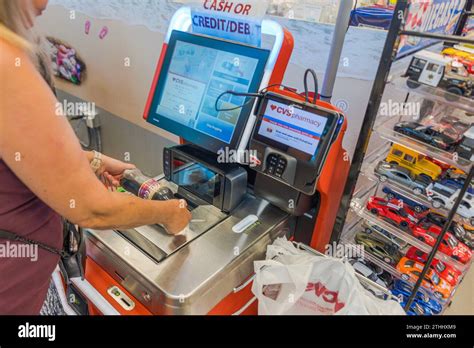 Close Up View Of A Woman Scanning Items At The Self Service Checkout In A Cvs Store Miami Beach