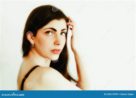 Portrait Of A Young Woman Against A White Background Stock Image