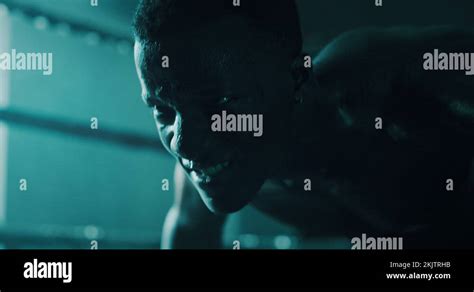 Young Muscular Shirtless African Man Practicing Shadow Boxing Workout