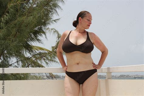 Plus Size Curve Full Figured Model On Beach Balcony In Bikini Swimwear
