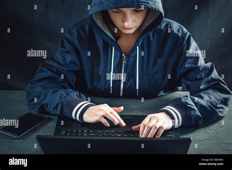 Hacker Teen Programmer Uses A Laptop To Hack The System Stealing Personal Data Creation And