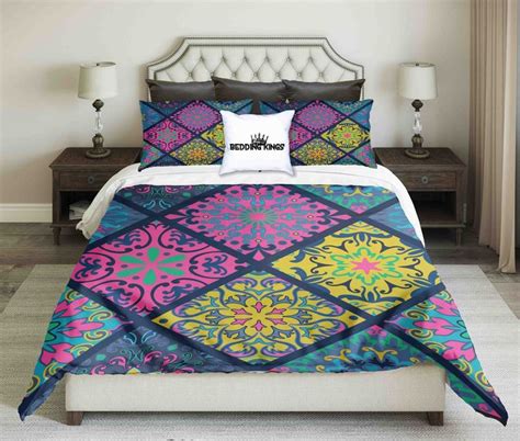 A Bed With Colorful Comforters And Pillows