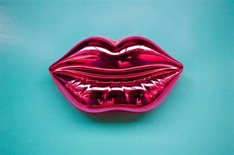 Premium Photo Lips Shaped Helium Balloon On Green Background