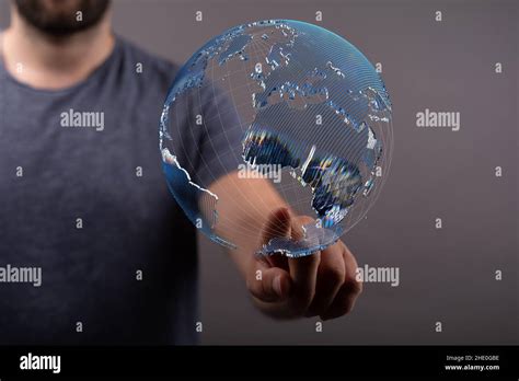 Businessman Tapping O A Floating Render Of A Globe Outline Global