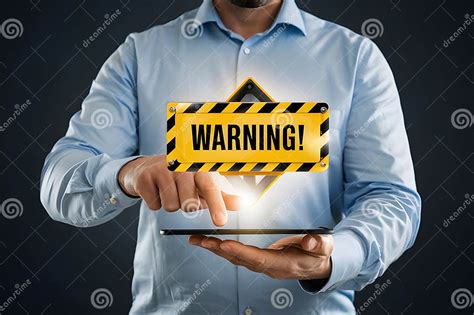 Man In Light Blue Shirt Interacts With Holographic Warning Sign Stock