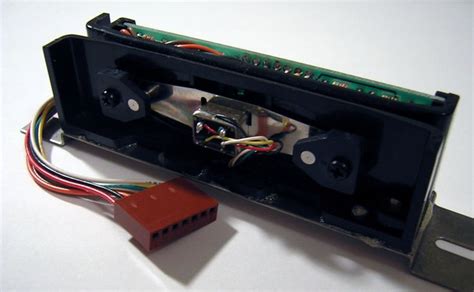 an electronic device with wires attached to the back of it s housing