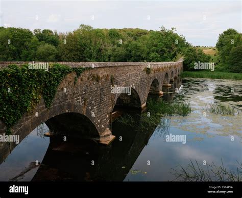 The Summer Evening Lake And Eight Arch Bridge Landscape Of Stackpole