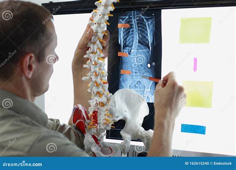 Scoliosis Specialist Doctor With Patients X Ray Royalty Free Stock