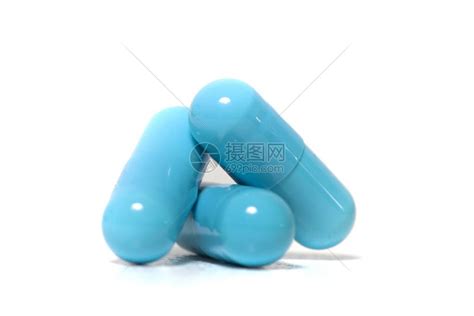 白色背景上的三颗蓝色药丸高清图片下载 正版图片502943395 摄图网