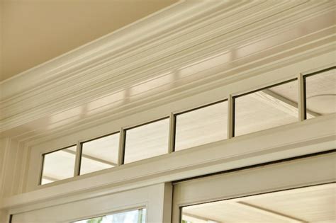 Premium Photo Elegant Crown Molding And Transom Windows Interior Detail