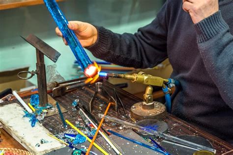 Premium Photo Midsection Of Man Using Blow Torch On Glass In Workshop
