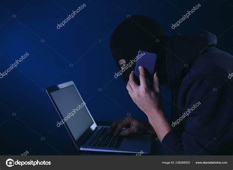Professional Hacker Mobile Phone Using Laptop Dark Background — Stock