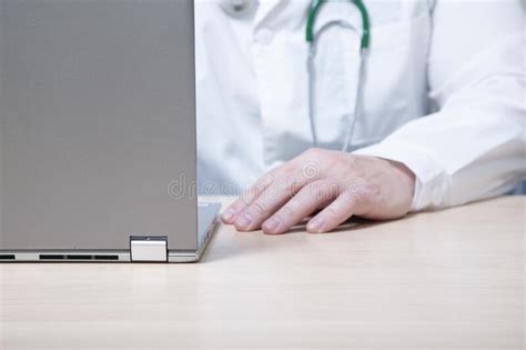 The Doctor Conducts The Patient S Appointment At The Hospital The