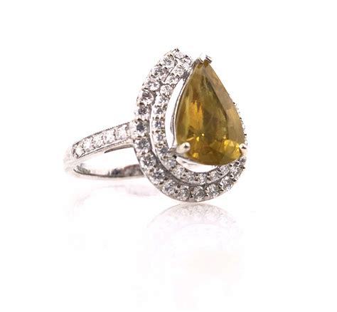 Lot 18k White Gold Pear Shape Yellow Sapphire Diamond Ring