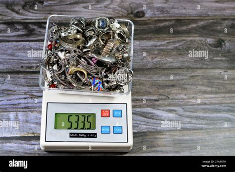 Pile Stack Of Silver On A Digital Accurate Scale In Grams Bracelets