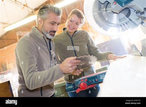 Man Showing Circular Saw To Female Stock Photo Alamy