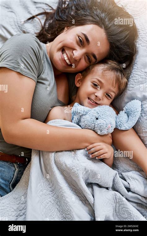Mommas First Love A Young Woman Bonding With Her Son At Home Stock