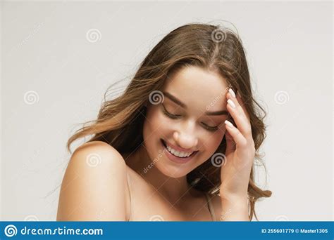 Closeup Portrait Of Young Cheerful Beautiful Girl With Curly Long Hair