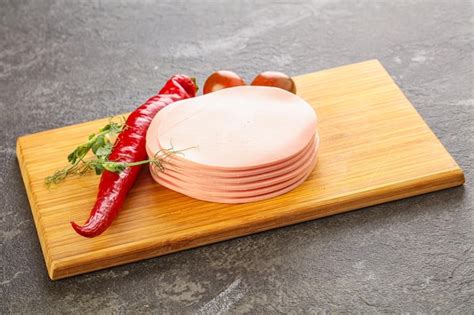 Premium Photo Sliced Pork Sausages Stack Over Board For Snack