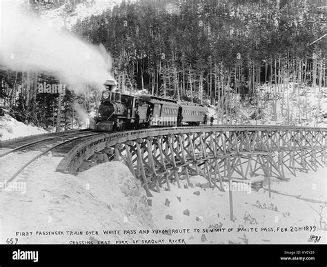 The First Passenger Train Of The White Pass And Yukon Railroad Crosses