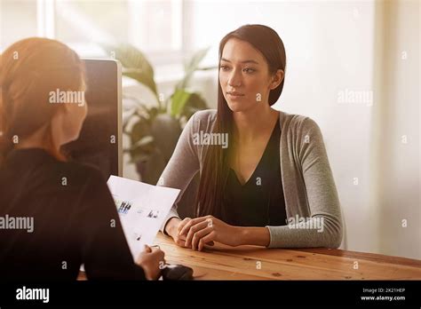 Interview In Progress Two Young Businesswomen Having A Discussion At A