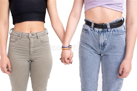 Slim Women Holding Hands With Lgbtq Flag Bracelets On White Background
