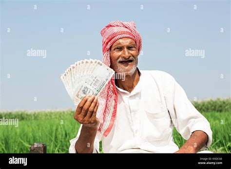 Indian Rural Farmer Old Man Showing Rupees Notes Sitting Field Stock