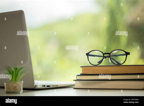 Object Education Green Nature Background With Stack Of Ancient Books Or Old Bible Open Paper