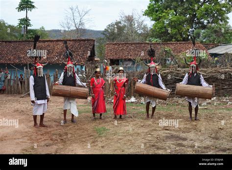 Tribal People Performing A Typical Tribal Dance In Traditional Outfits