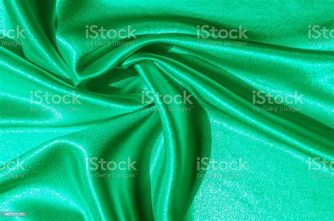 텍스처 직물 배경입니다 고급 스러운 직물 또는 액체 파도의 물결 그런 지 주름 실크 새틴 질감의 벨벳 소재 또는 고급 스러운 크리스마스 또는 우아한 배경 추상적인 배경 그린