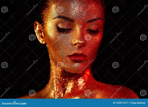 Portrait Of Beautiful Woman With Sparkles On Her Face Stock Image
