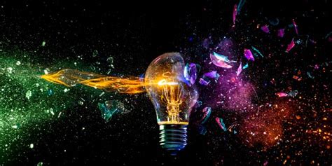 Premium Photo Exploding Light Bulb Concept On Dark Background