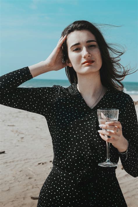 Woman In Black V Neck Long Sleeve Shirt Holding Clear Wine Glass Photo