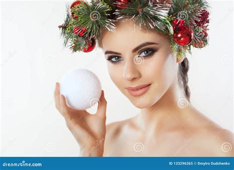 A Pretty Young Woman Holds In Her Hand A Christmas Ball On Her Head A