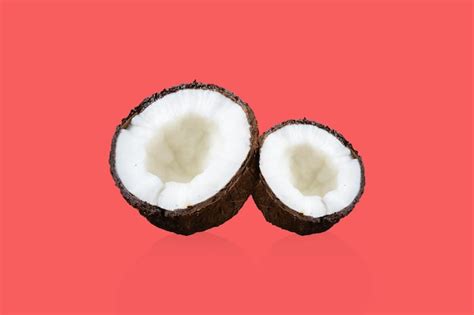 Premium Photo Coconuts On Red Surface