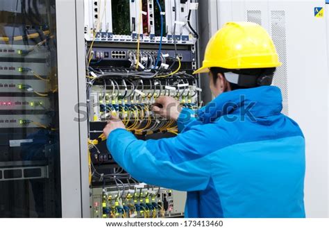 Man Connecting Network Cables Switches Stock Photo Edit Now