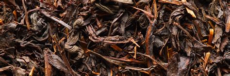 Black Large Leaf Tea As Abstract Background Texture Of Dry Black Tea