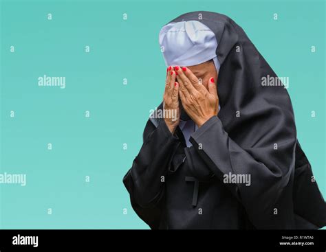 Middle Age Senior Christian Catholic Nun Woman Over Isolated Background