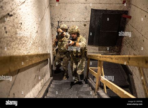 British Royal Marine Commandos Practice Room Clearing A Stairwell