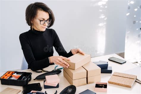 Female Entrepreneur Packing Sustainable Cardboard Boxes For Her