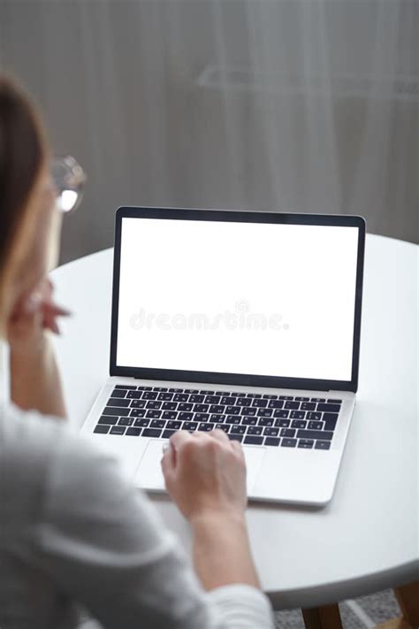 Mockup White Screen Laptop Woman Using Computer While Sitting At Table At Home Back View Stock