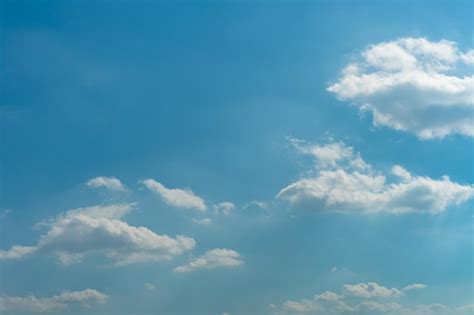 Premium Photo Beautiful Fluffy Clouds In The Evening Sky The Sunlight Gives A Side Light On