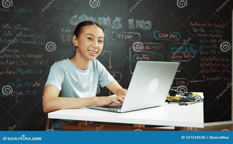 Cute Asian Girl Programing System By Using Laptop At Blackboard