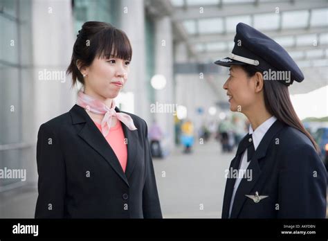 Female Pilot Talking To A Female Cabin Crew Stock Photo Alamy