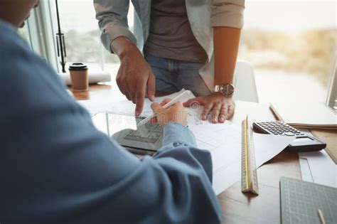 Architects And Interior Designers Women Discussing To Concept Of Building Design Estimation For