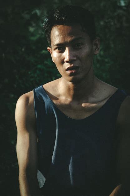 Premium Photo Young Man Looking Away Against Black Background