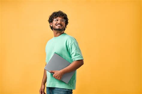 Premium Photo Portrait Of Handsome Curly Indian Man In Turquoise