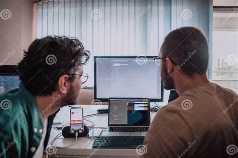 Programmers Engrossed In Deep Collaboration Diligently Working Together To Solve Complex
